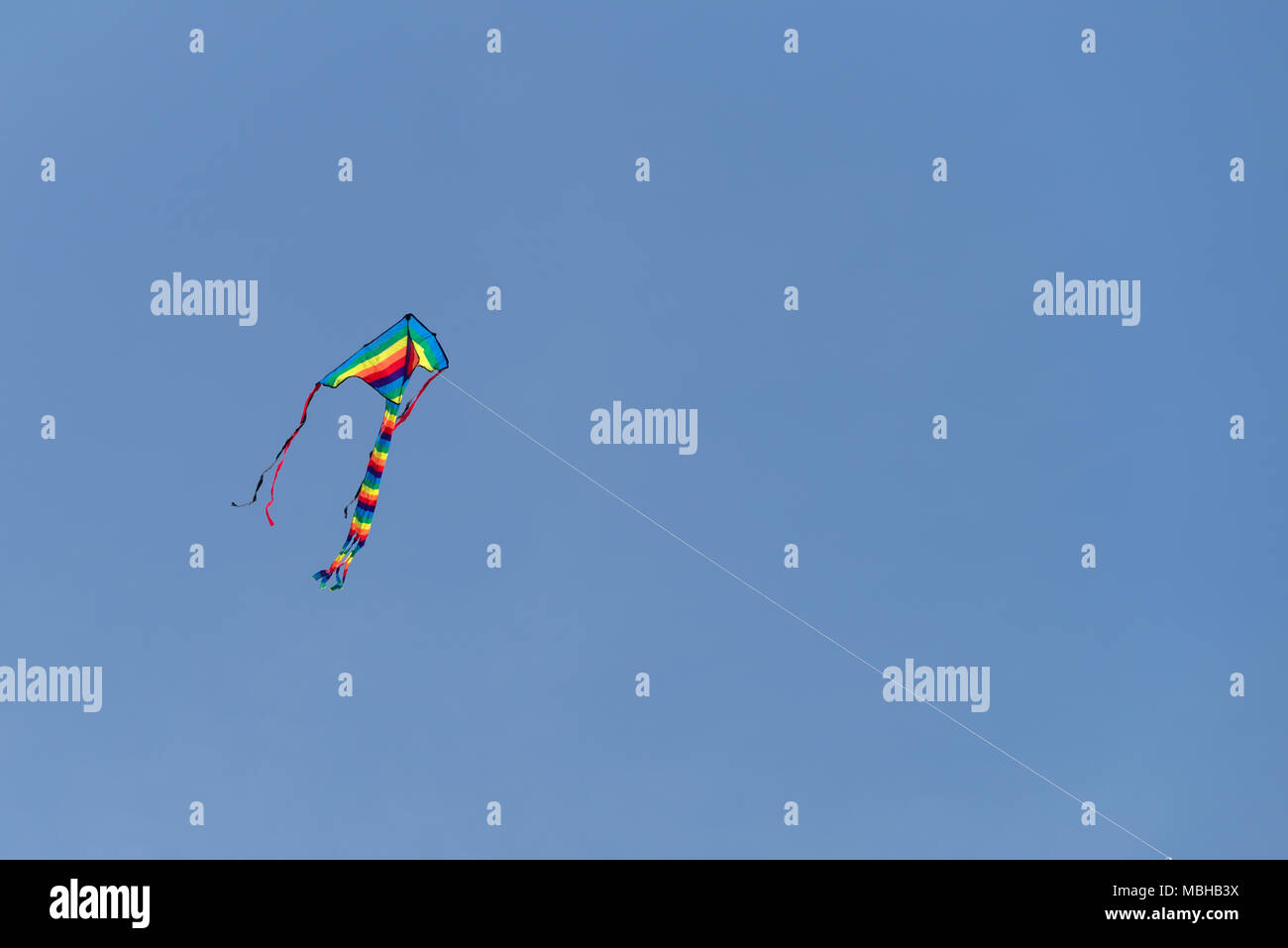 Low angle view of kite flying against clear sky Stock Photo - Alamy