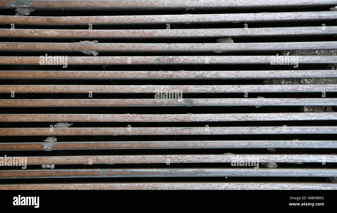 Drain grates with light background texture Stock Photo - Alamy