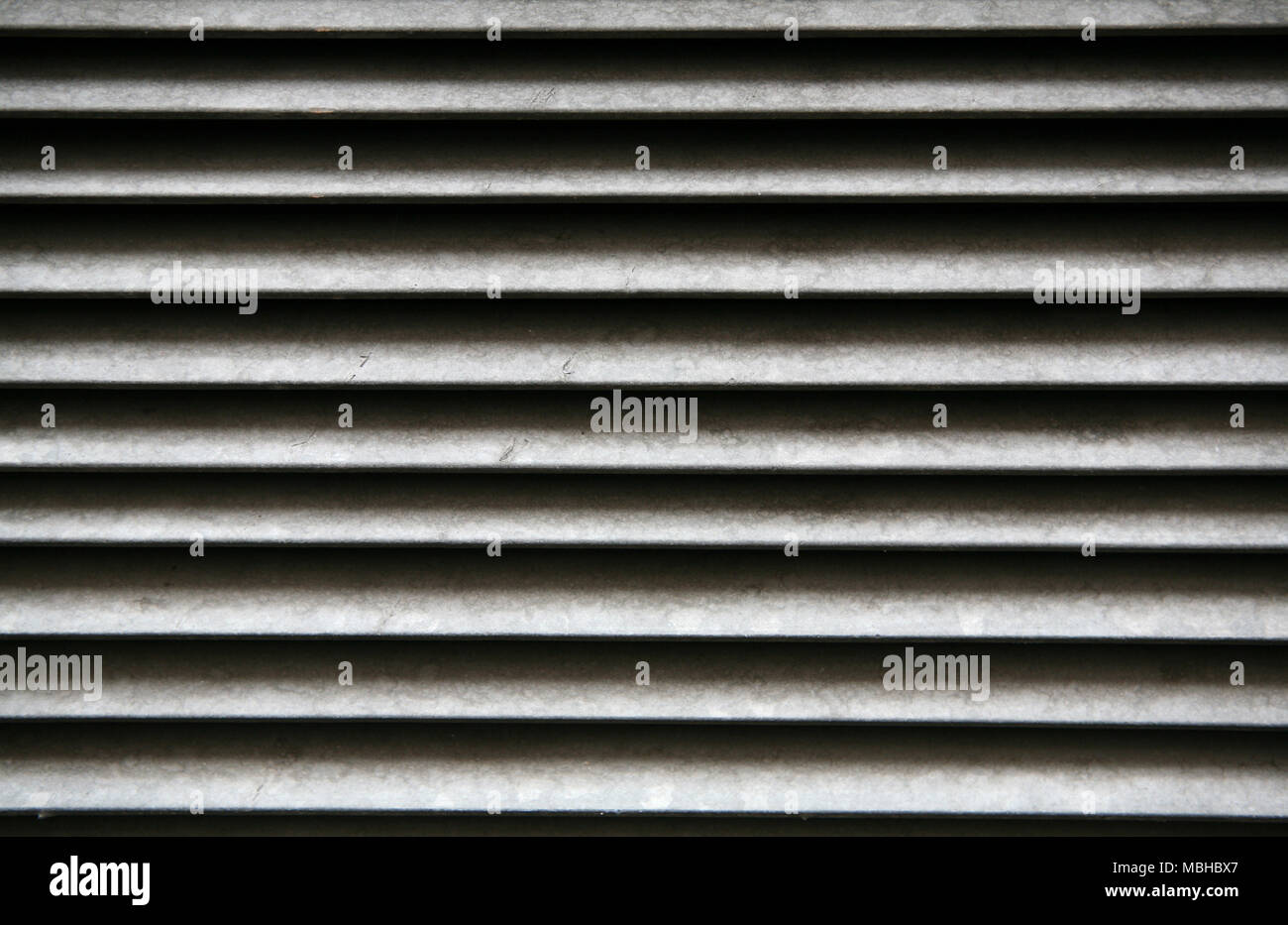 Drain grates with light background texture Stock Photo - Alamy