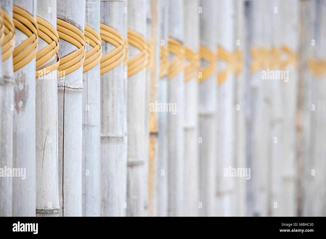 light color wood and yellow loop rope closeup background Stock Photo ...