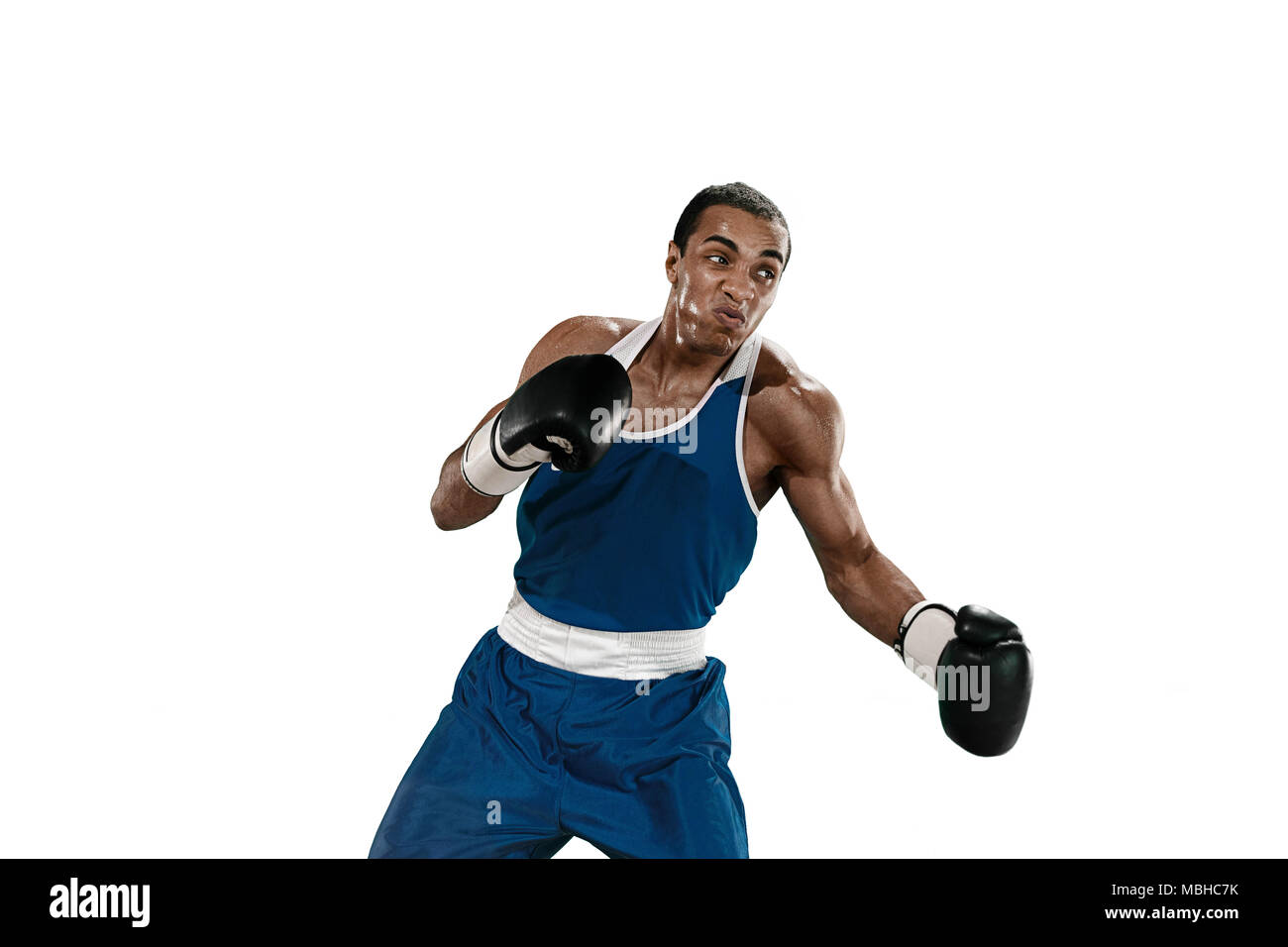 Sporty man during boxing exercise making hit. Photo of boxer on white ...