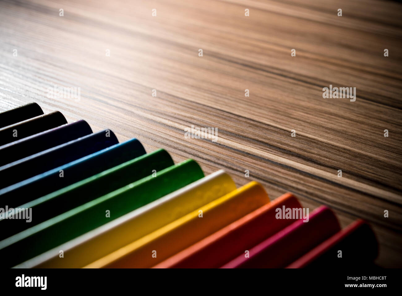 colorful rainbow pencils on the brown table background Stock Photo - Alamy