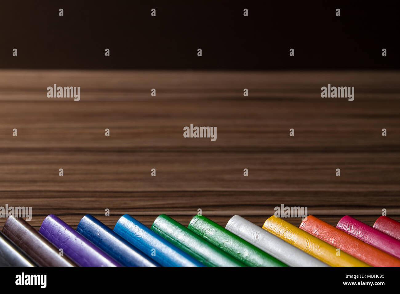 colorful rainbow pencils on the brown table background Stock Photo - Alamy