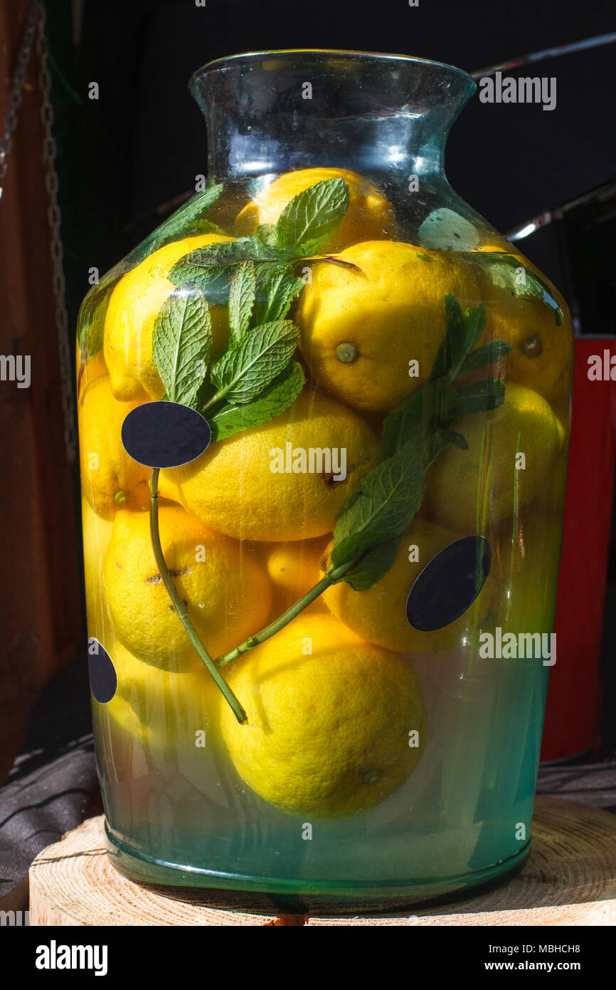 Refreshing drink from lemon and peppermint. A large jar Full Of Whole ...