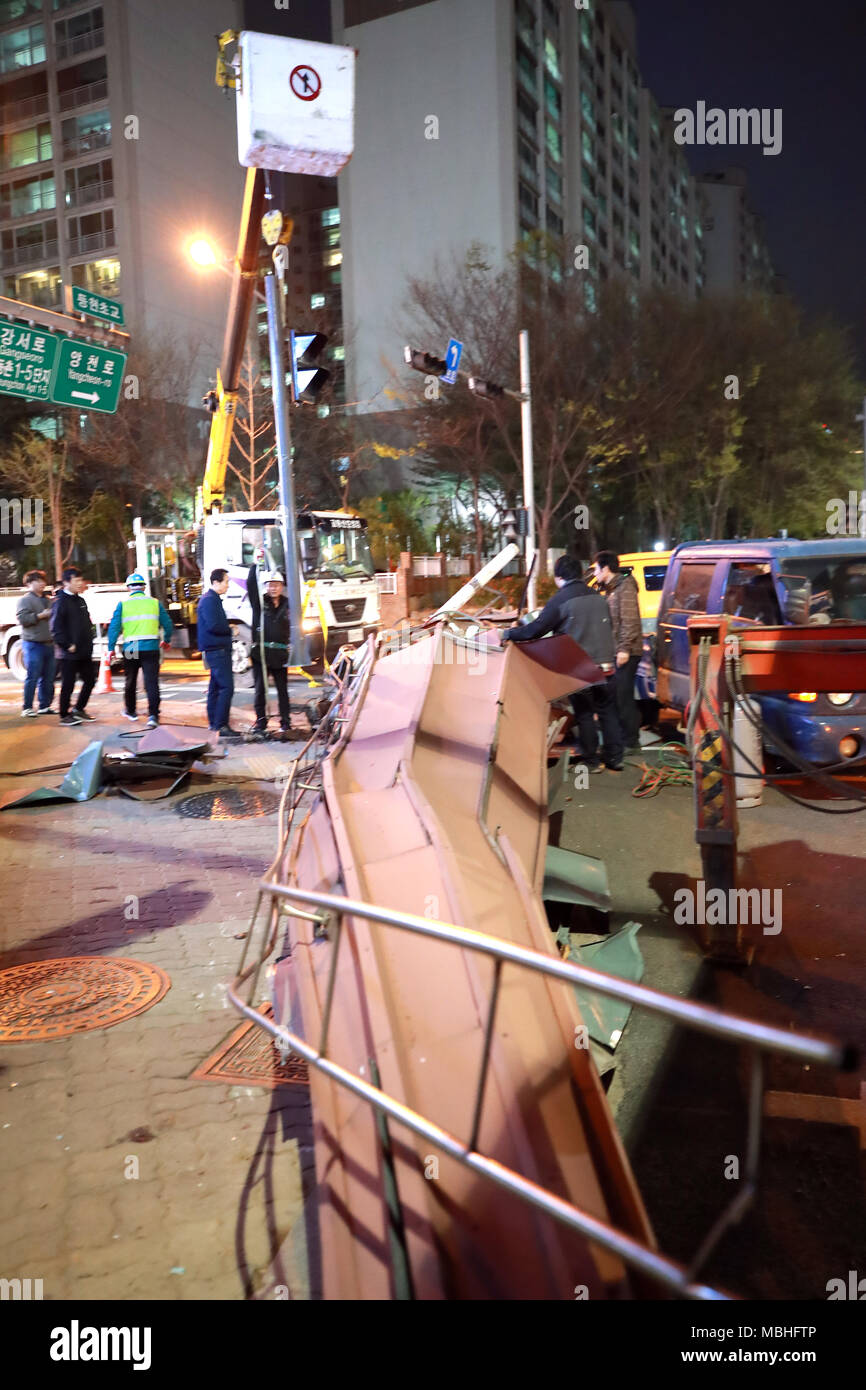 11th Apr, 2018. Gale damage Workers remove a steel tower, which fell ...
