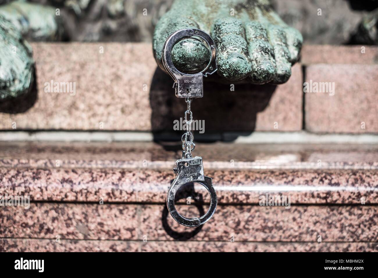 Hanging handcuffs hi-res stock photography and images - Alamy