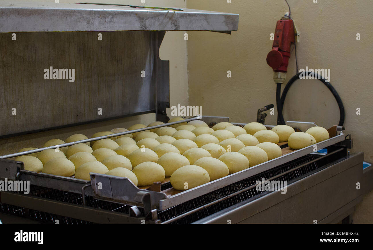 Working on a sweet pastry in a big industrial bakery Stock Photo - Alamy