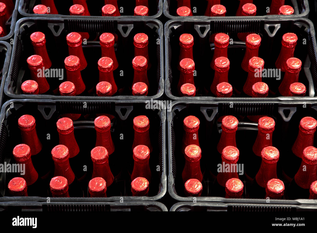 A group of red bottles in beer crates Stock Photo - Alamy