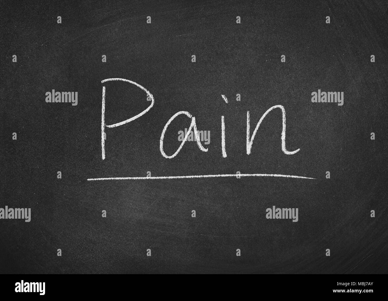 pain concept word on a blackboard background Stock Photo - Alamy