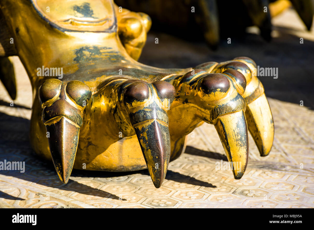 A bronze lion's paw, a statue in Forbidden City Stock Photo - Alamy