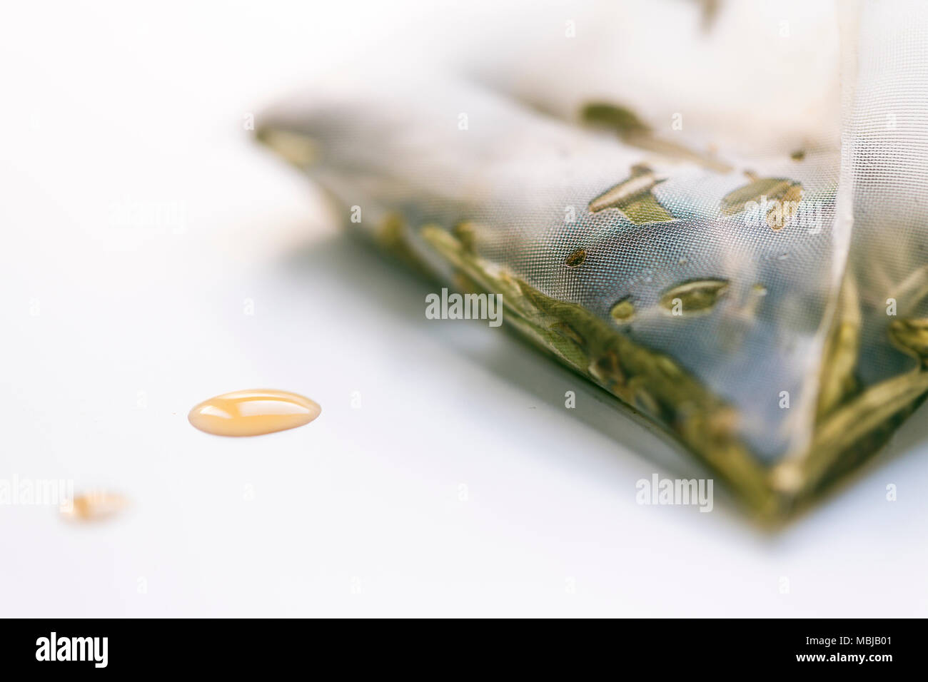 Triangle tea bags on white background Stock Photo - Alamy