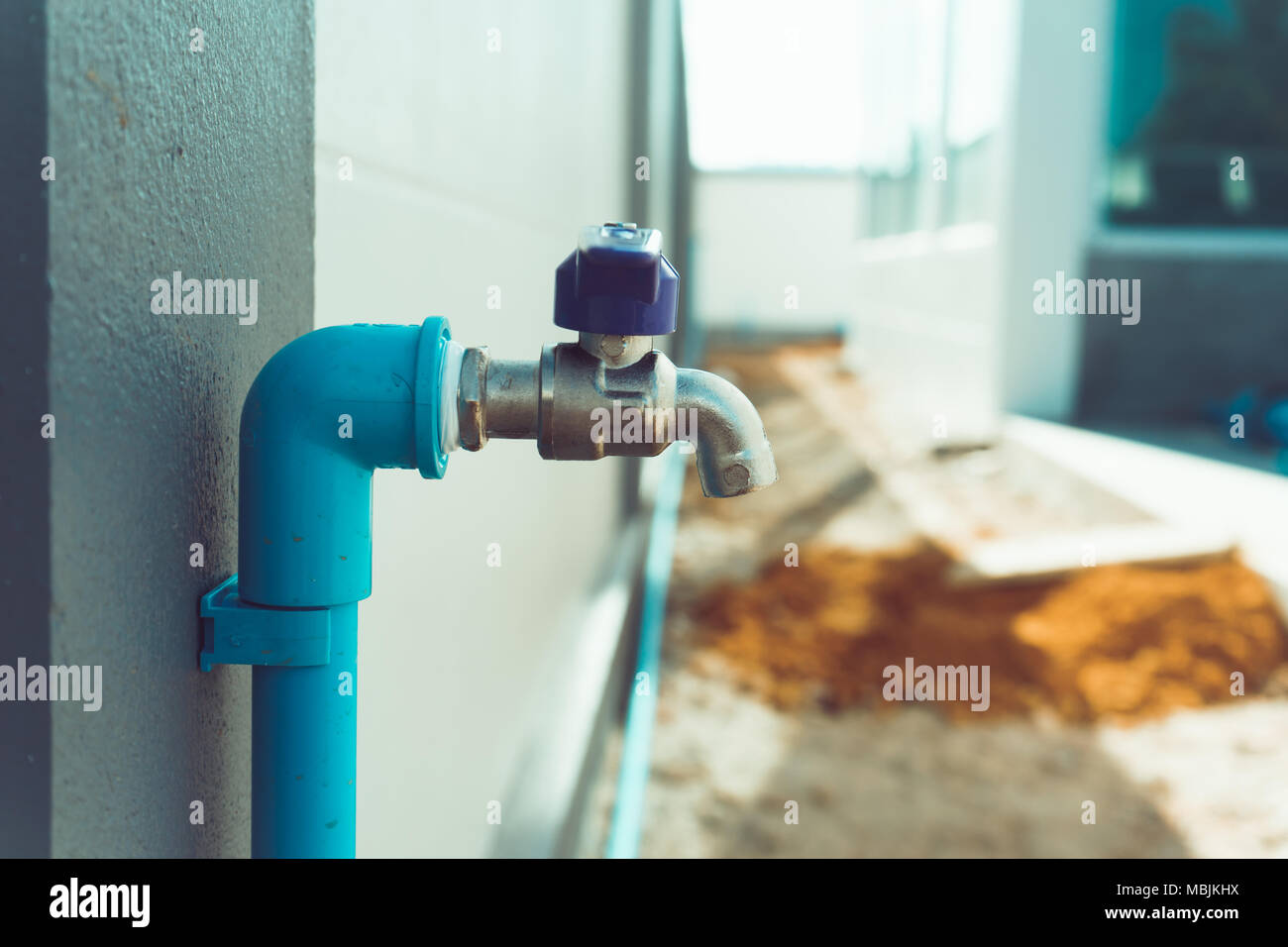 Water tap on blur background Stock Photo - Alamy
