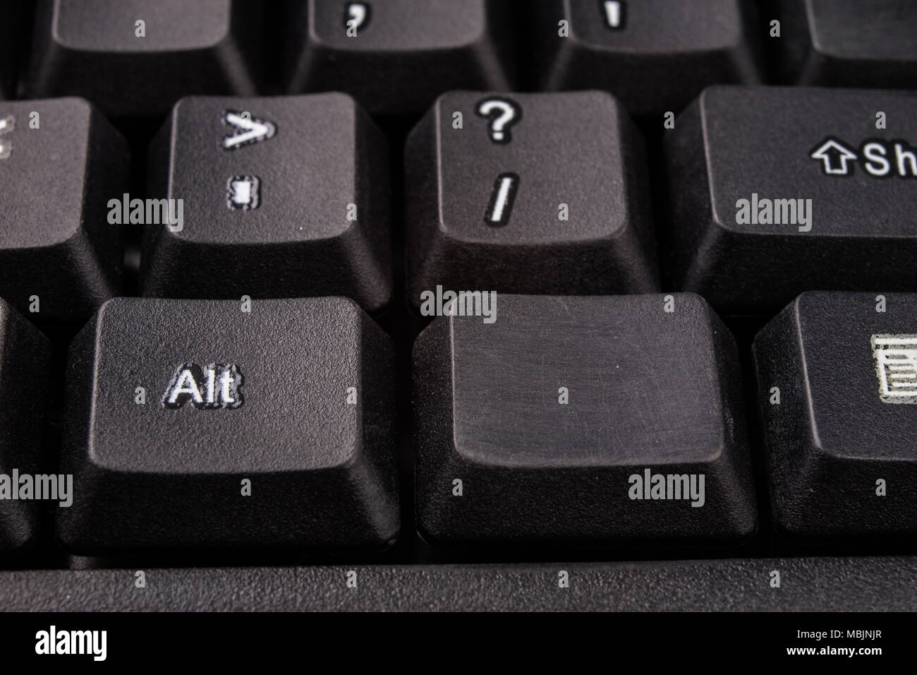 An enlarged computer keyboard. Black keyboard buttons for the computer ...
