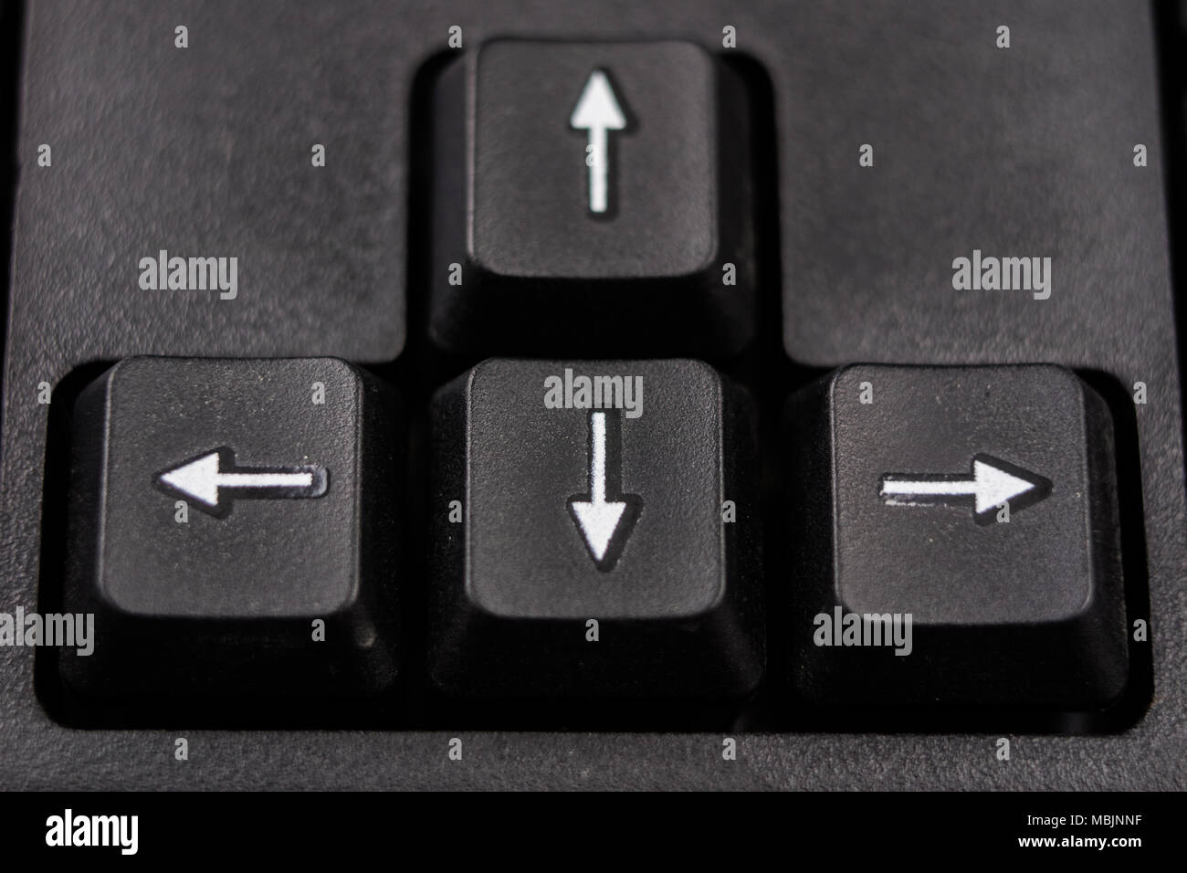 An enlarged computer keyboard. Black keyboard buttons for the computer ...