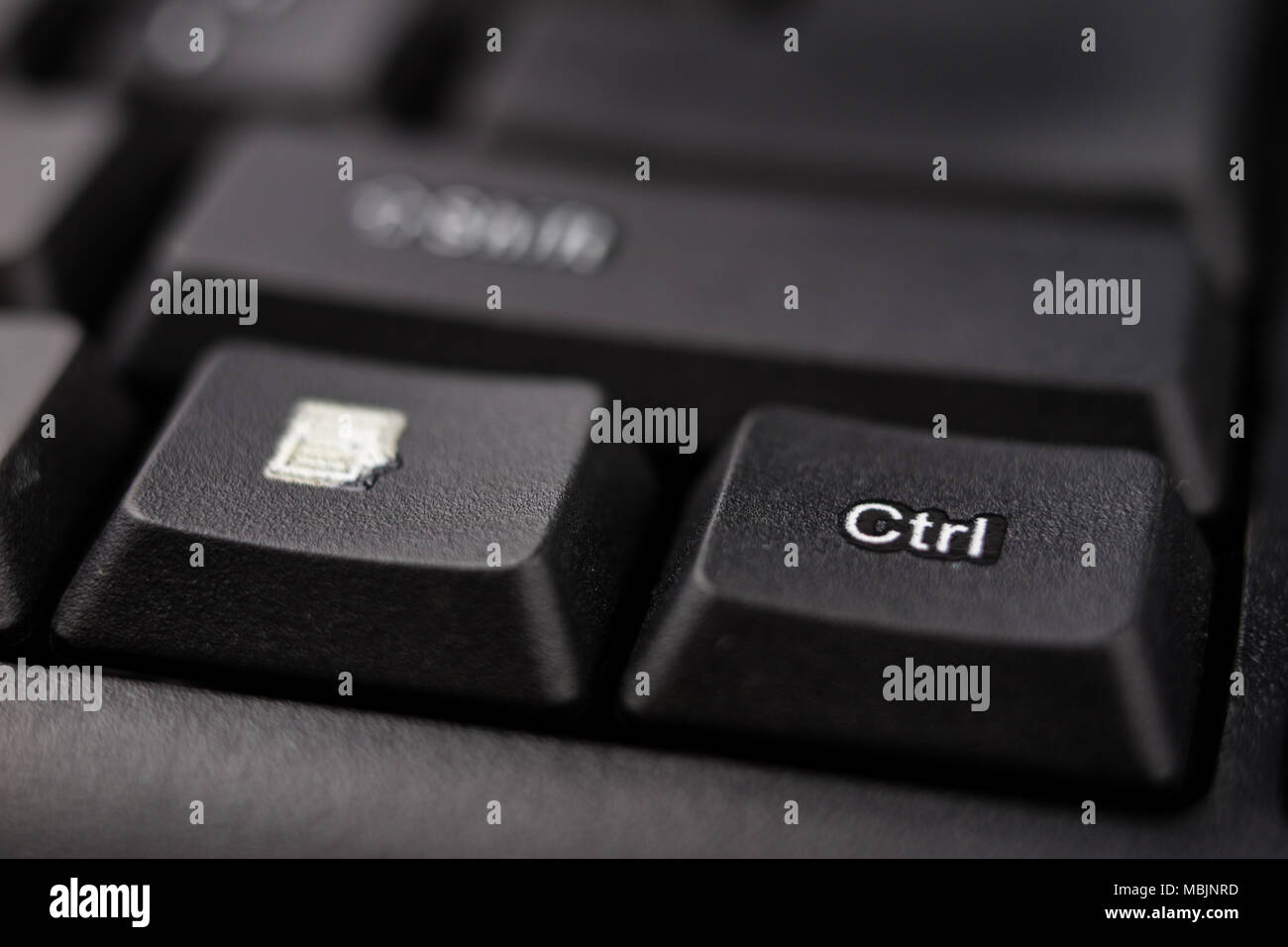 An enlarged computer keyboard. Black keyboard buttons for the computer ...