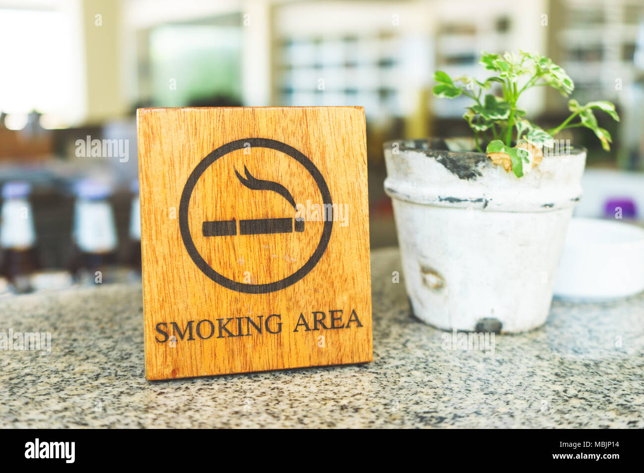 Wooden Smoking Area with Mini Tree Pot Stock Photo - Alamy