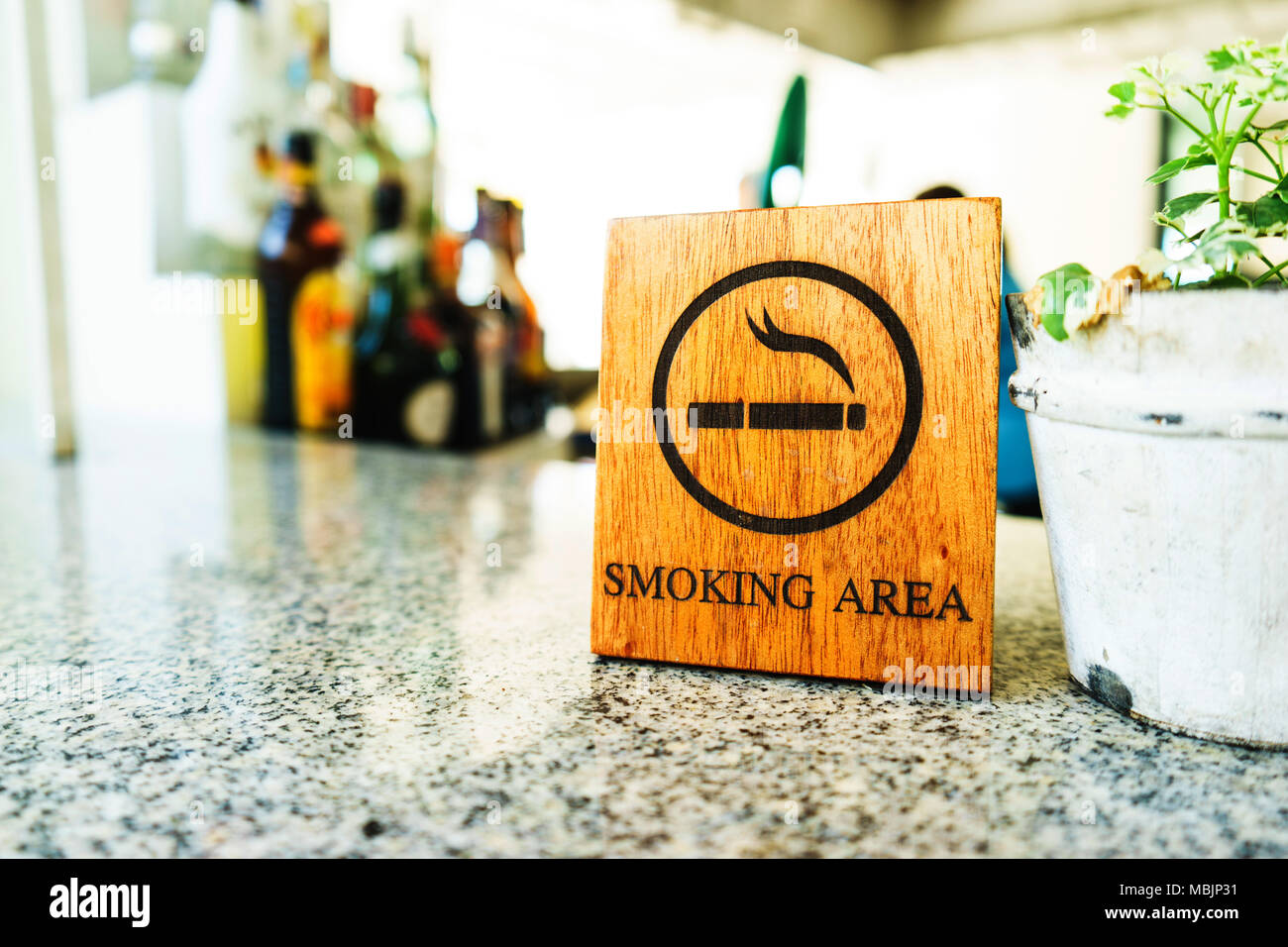 Wooden Smoking Area with Mini Tree Pot Stock Photo - Alamy