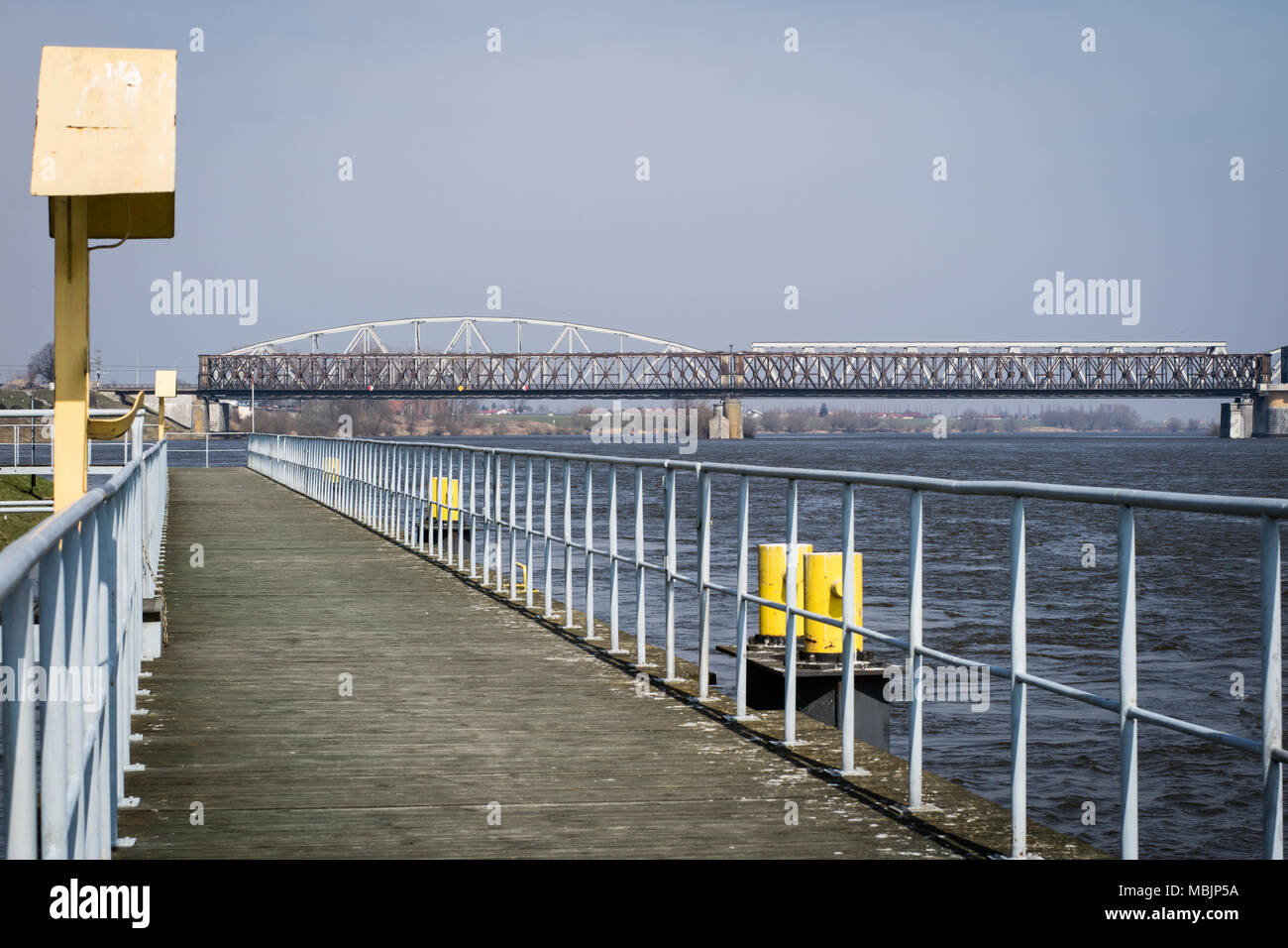 Bridge crossing across a large river. Truss bridge in the city of Tczew ...