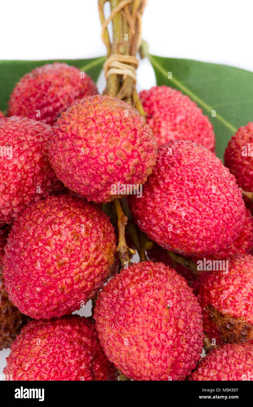 bunch of fresh lychee with leaf on white background Stock Photo - Alamy