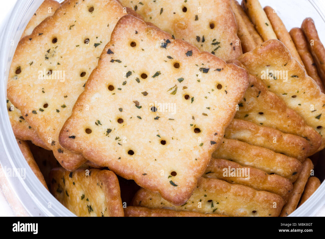 Vegetable crackers in plastic box - closed up Stock Photo - Alamy