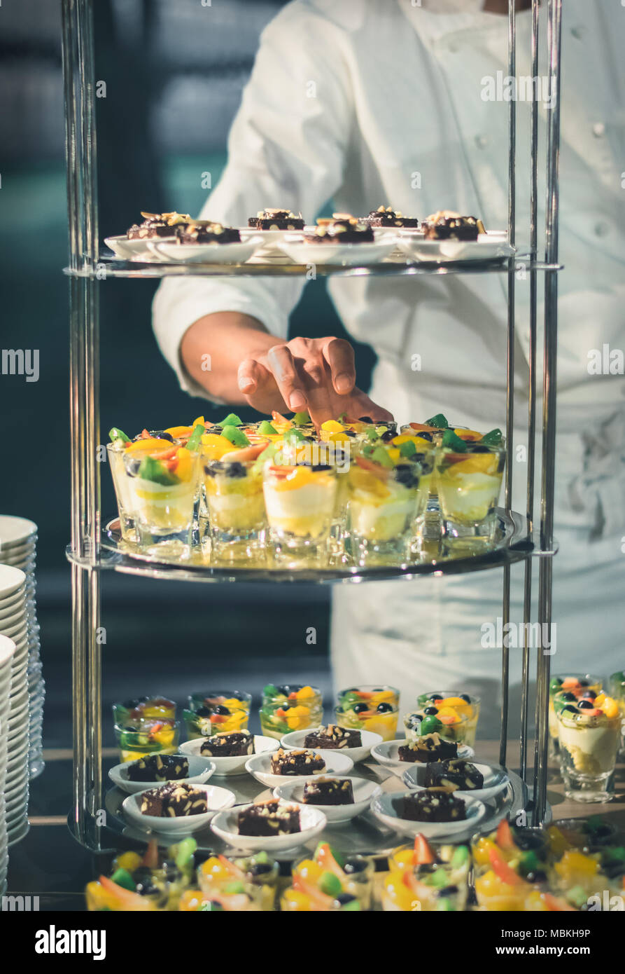 restaurantâ€™s chef preparing buffet sweet dessert dinner Stock Photo ...