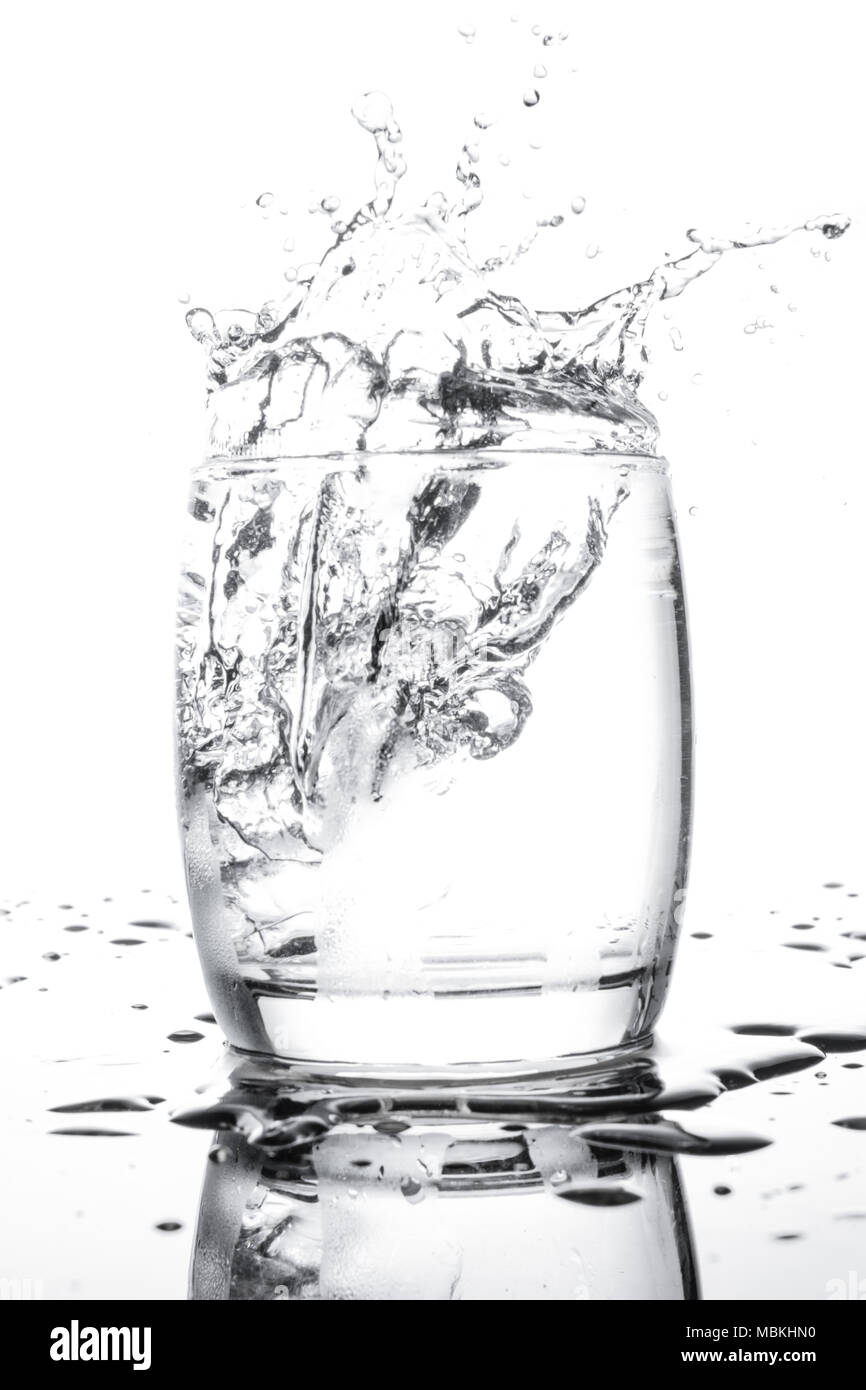 water isolate splash in cup on white background Stock Photo - Alamy