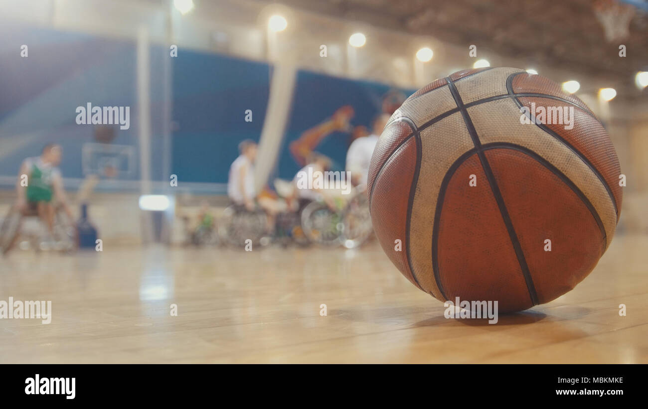 Ball of basketball during training for disabled wheelchair sportsmen ...