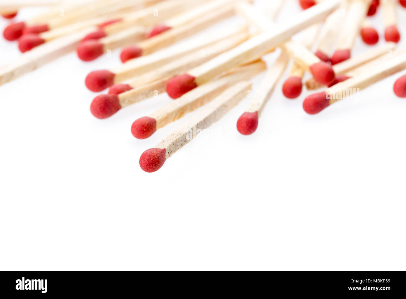 Several red matches on white background Stock Photo - Alamy