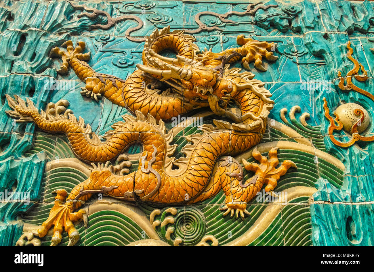 The dragon sculpture on Nine Dragon Screen of Beihai park, Beijing ...