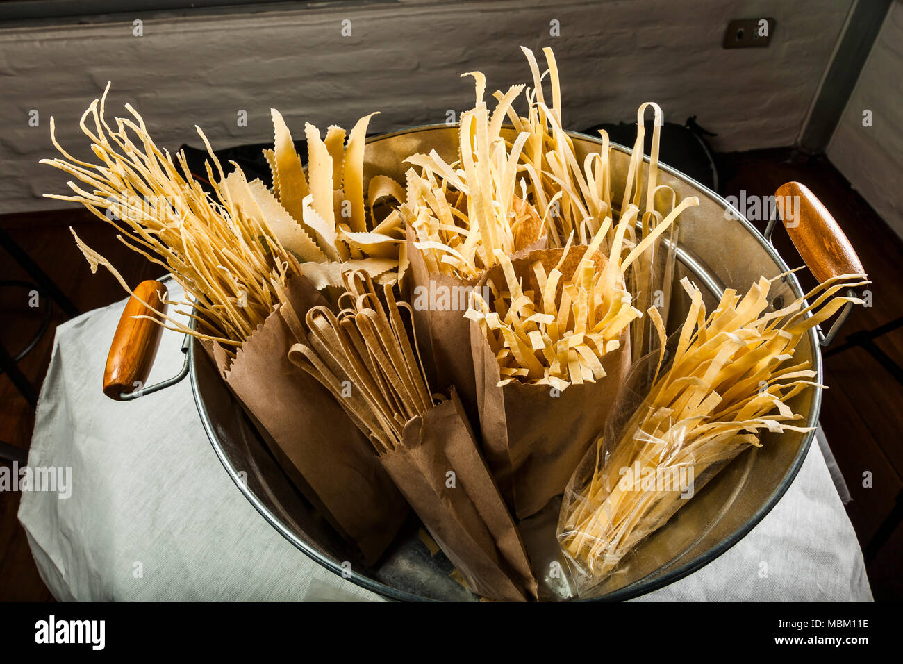 Various types of pasta on a metal tub Stock Photo - Alamy
