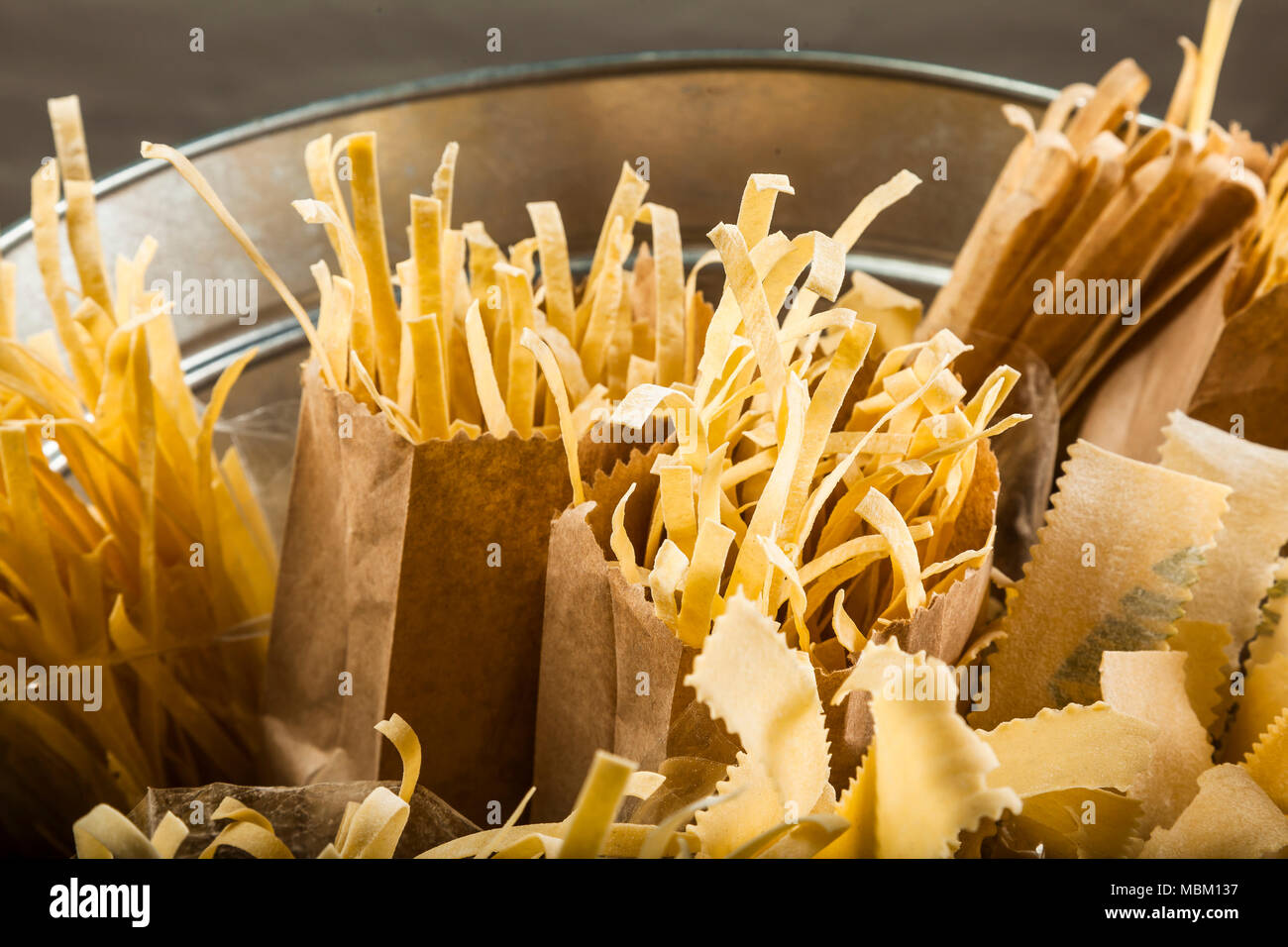 Various types of pasta on a metal tub Stock Photo - Alamy