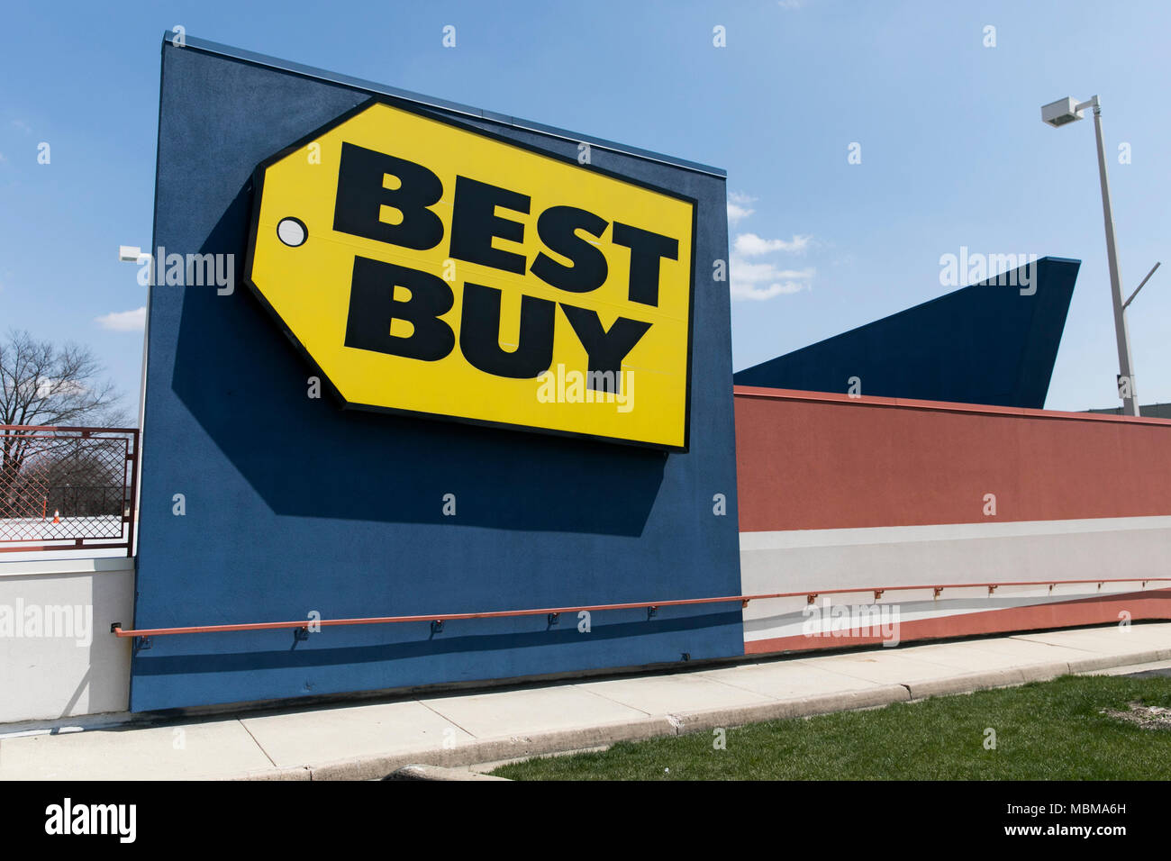 A logo sign outside of a Best Buy retail store location in Wheaton ...