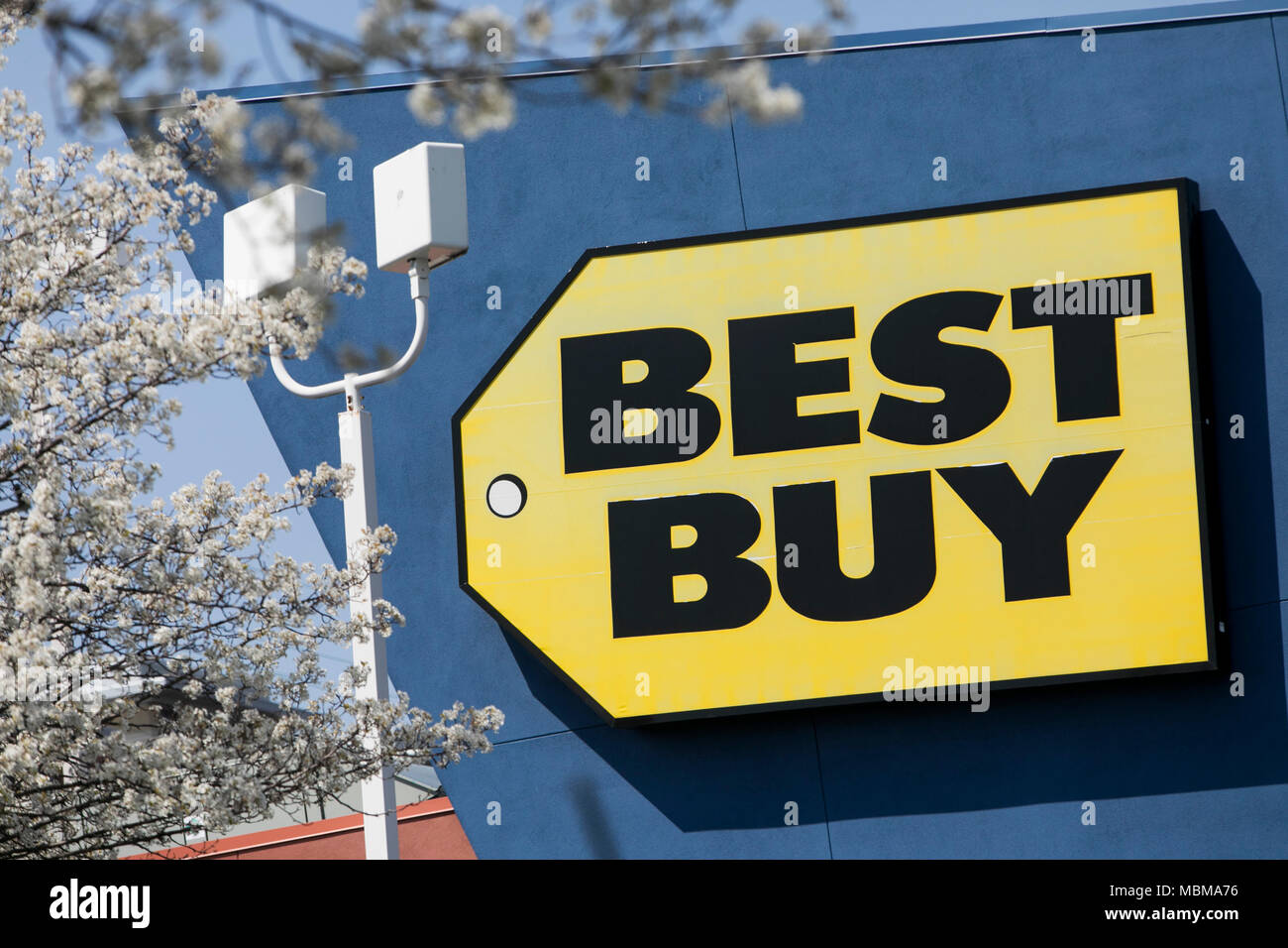 A logo sign outside of a Best Buy retail store location in Wheaton ...