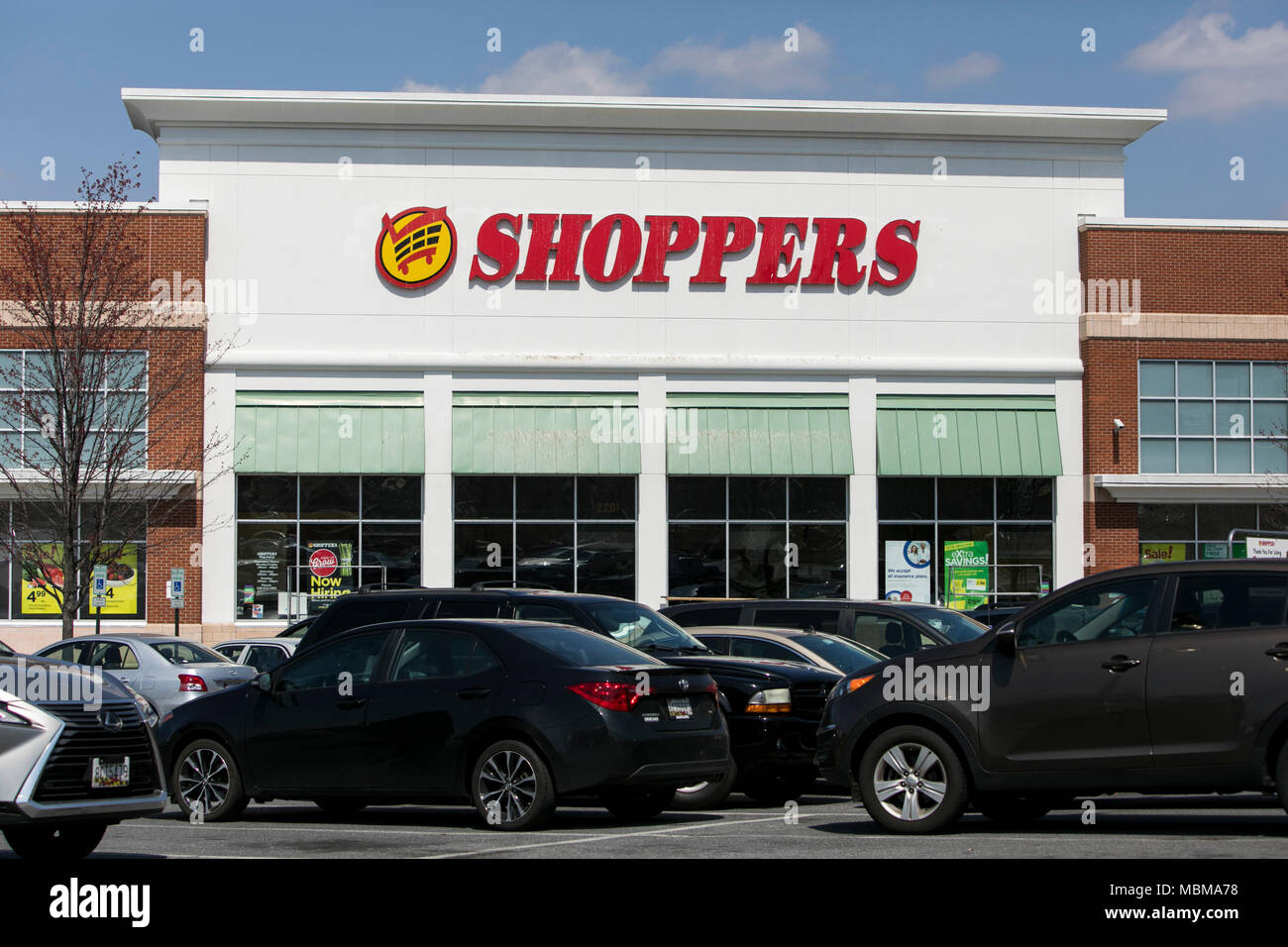 A logo sign outside of a Shoppers Food & Pharmacy grocery retail store ...