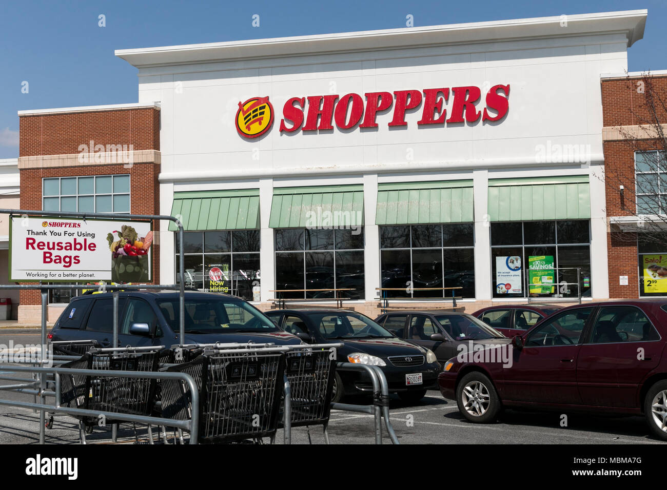 A logo sign outside of a Shoppers Food & Pharmacy grocery retail store ...