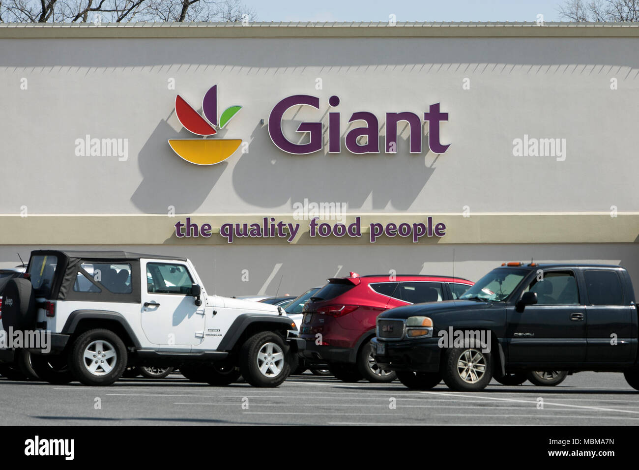 A logo sign outside of a Giant Food grocery retail store location in ...