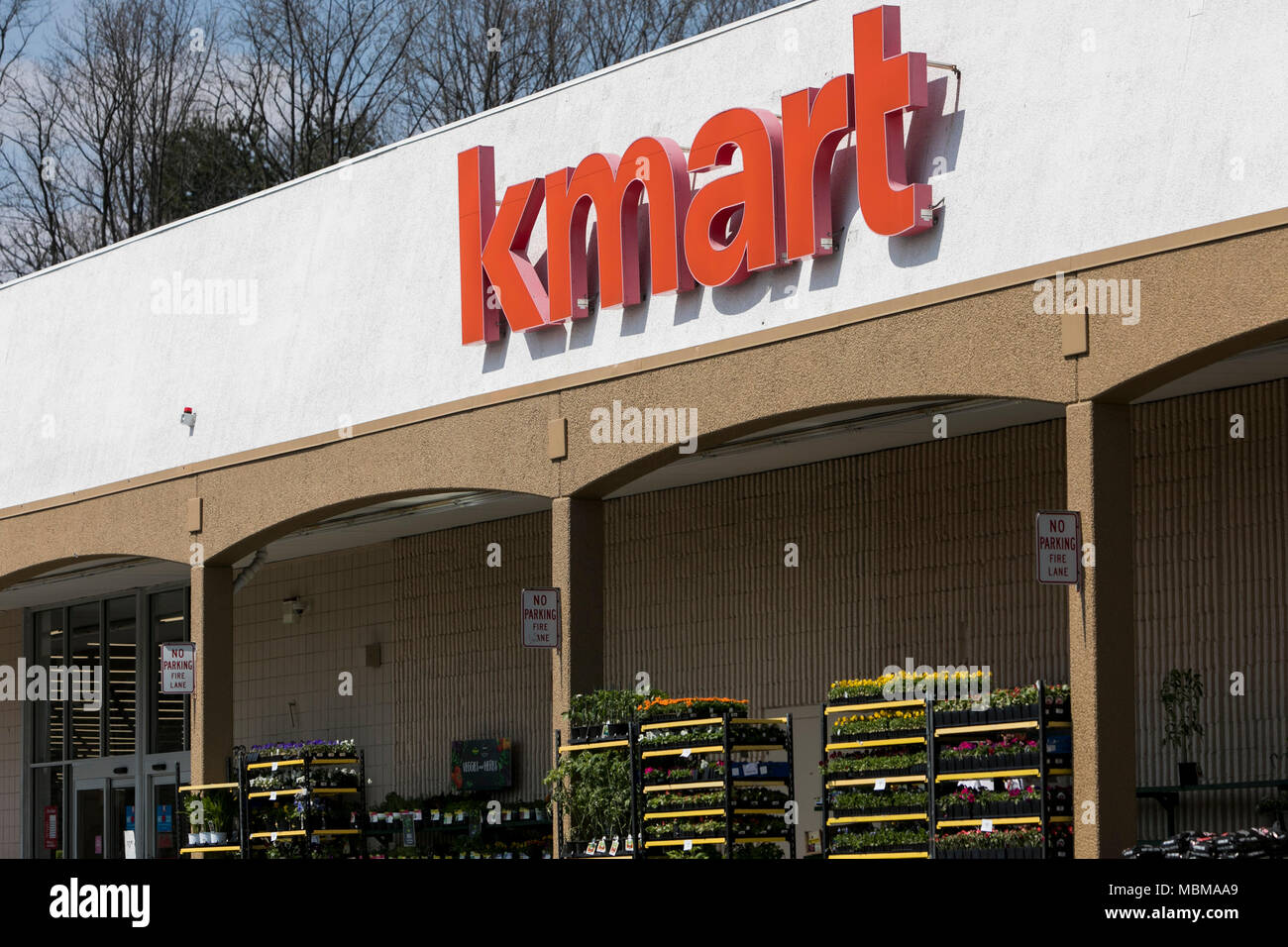 A logo sign outside of a Kmart retail store location in Silver Spring ...