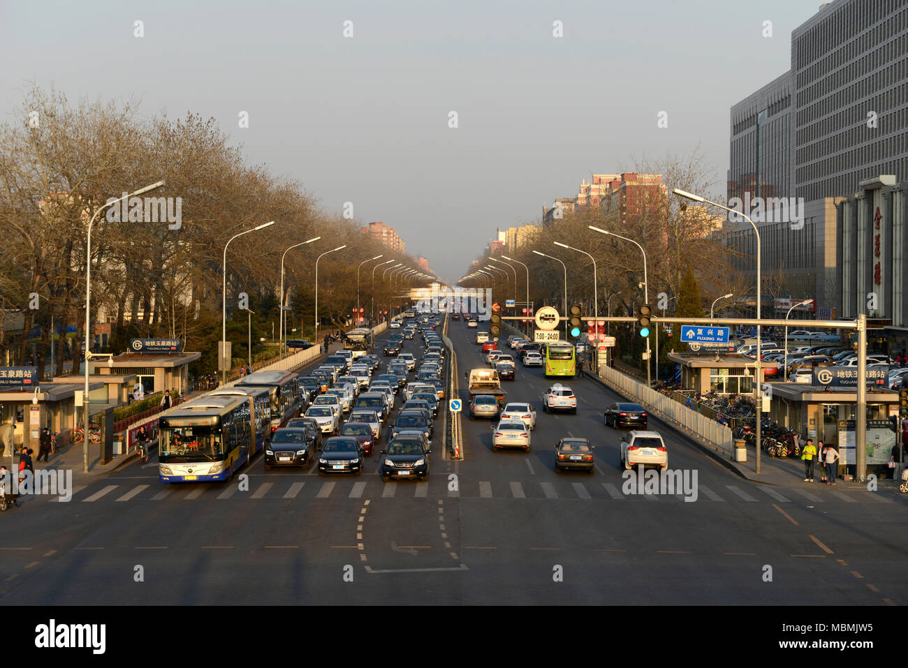 Traffic waits at stop lights at the junction of Fuxing Road and Yuquan ...