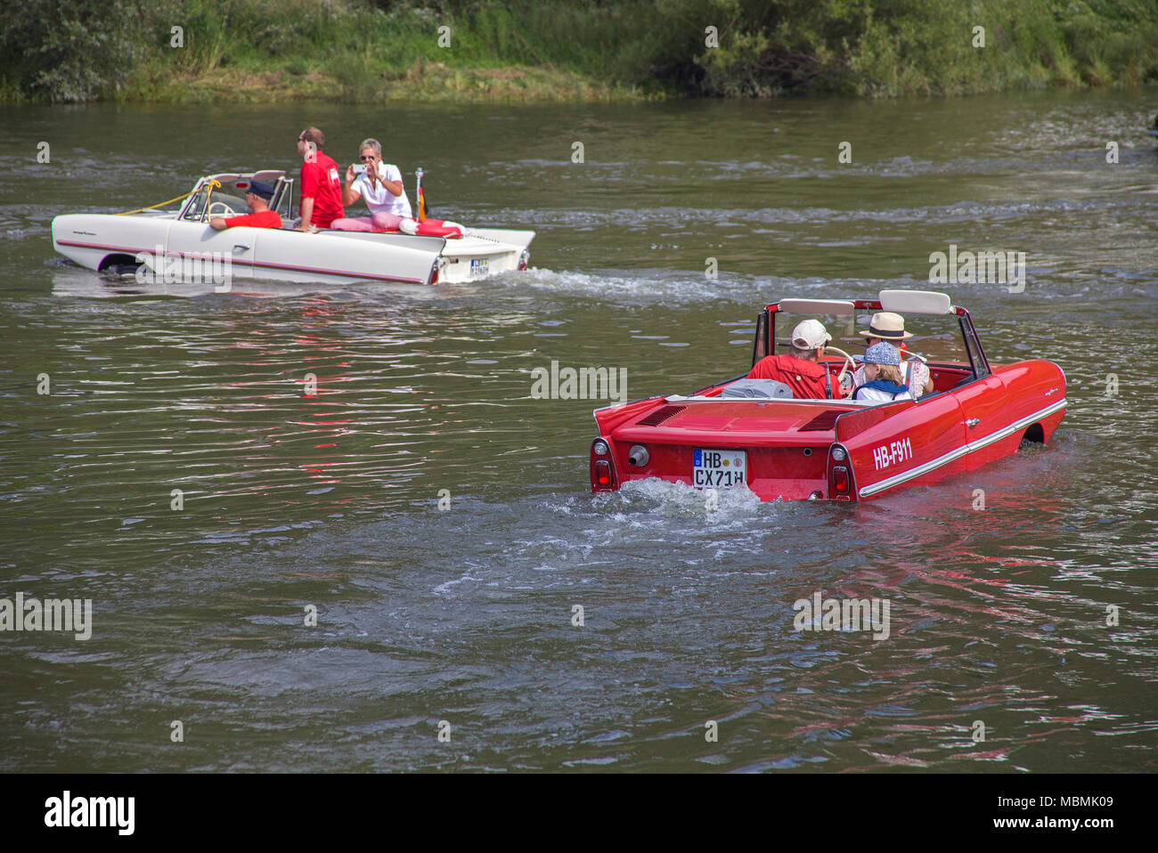 Amphic car, a german amphibious vehicle driving on Moselle at Cochem ...