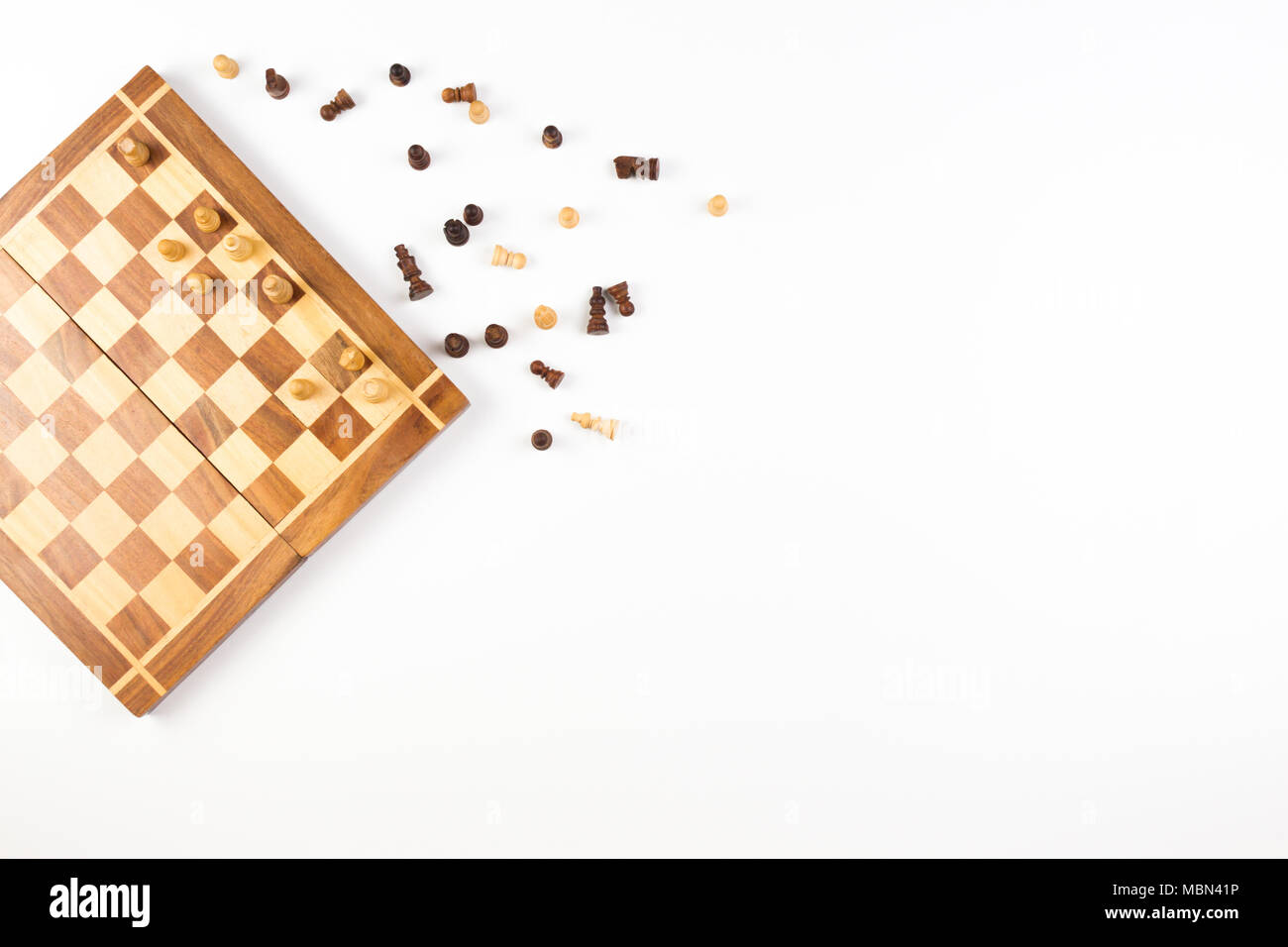 Top view of chess board with chess pieces on white background Stock ...