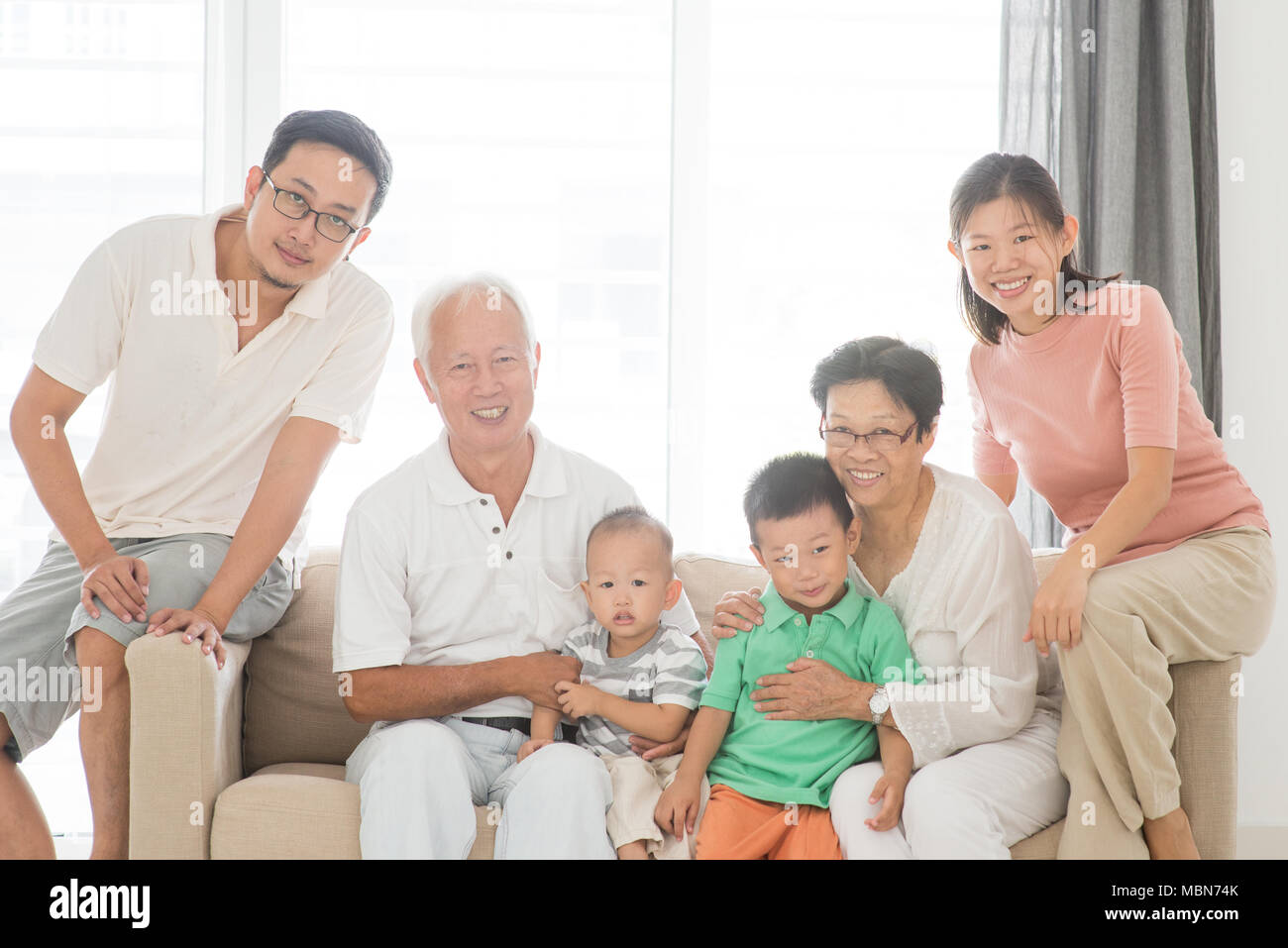 Happy Asian family at home, portrait of multi generations indoor ...