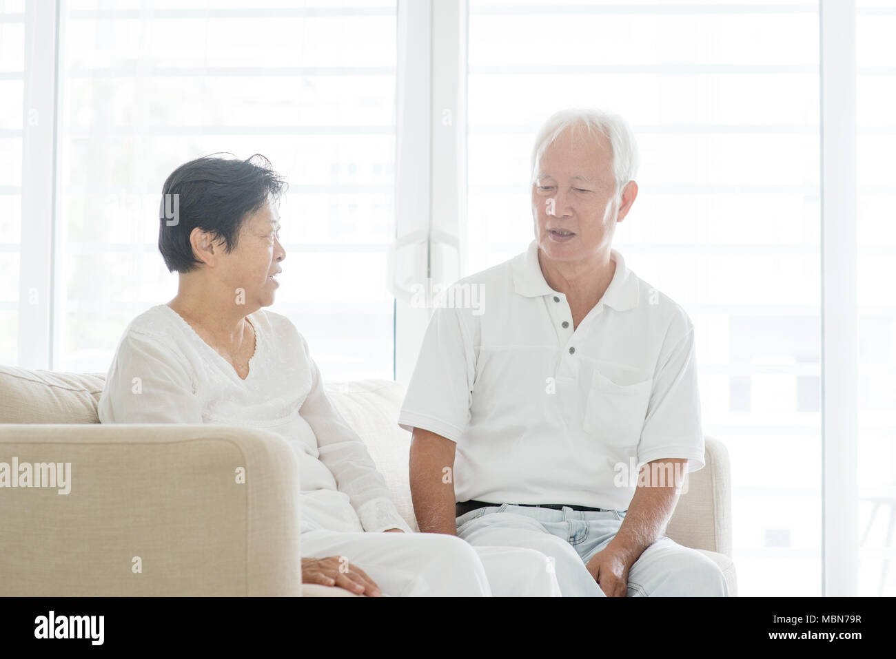 Portrait of serious Asian elderly couple talking at home, old senior ...