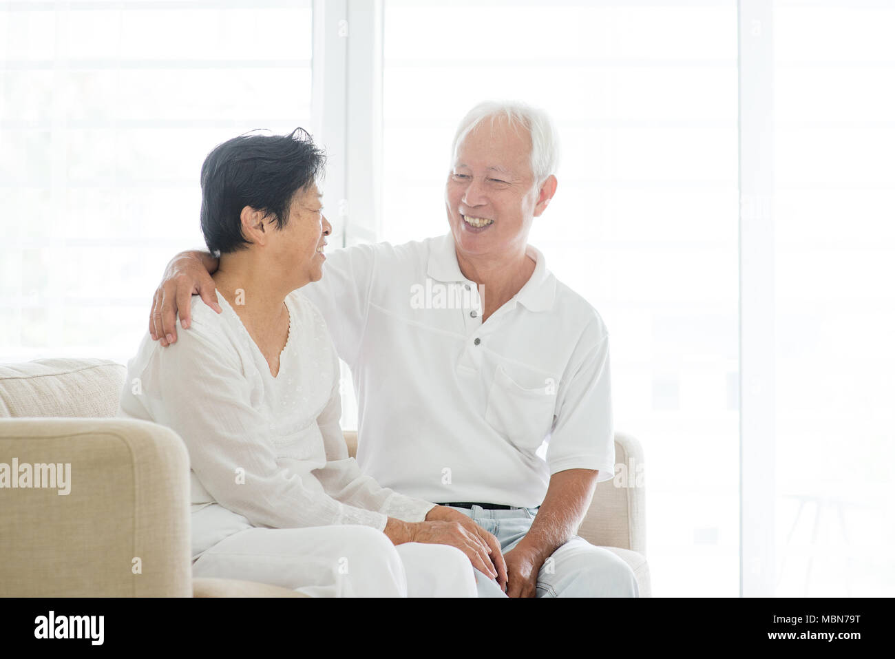 Portrait of Asian elderly couple talking at home, old senior retired ...