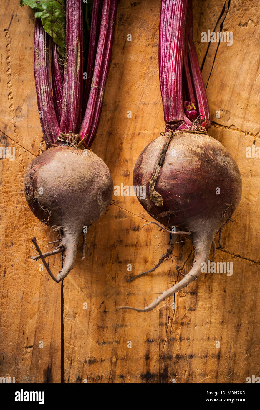 Studio still life of beets on a rough wooden background Stock Photo - Alamy