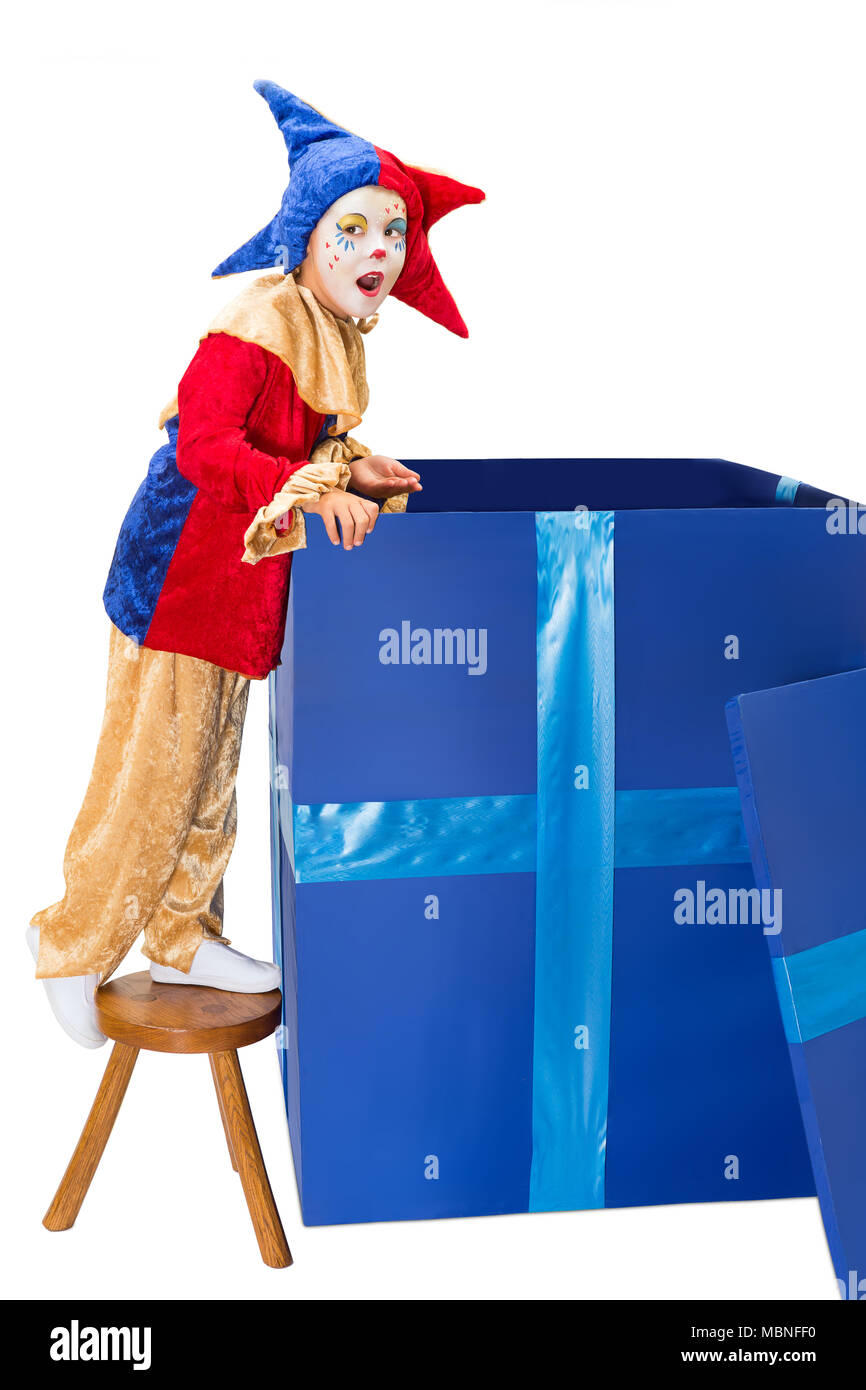 Little jester clown looking into a big blue surprise box Stock Photo ...