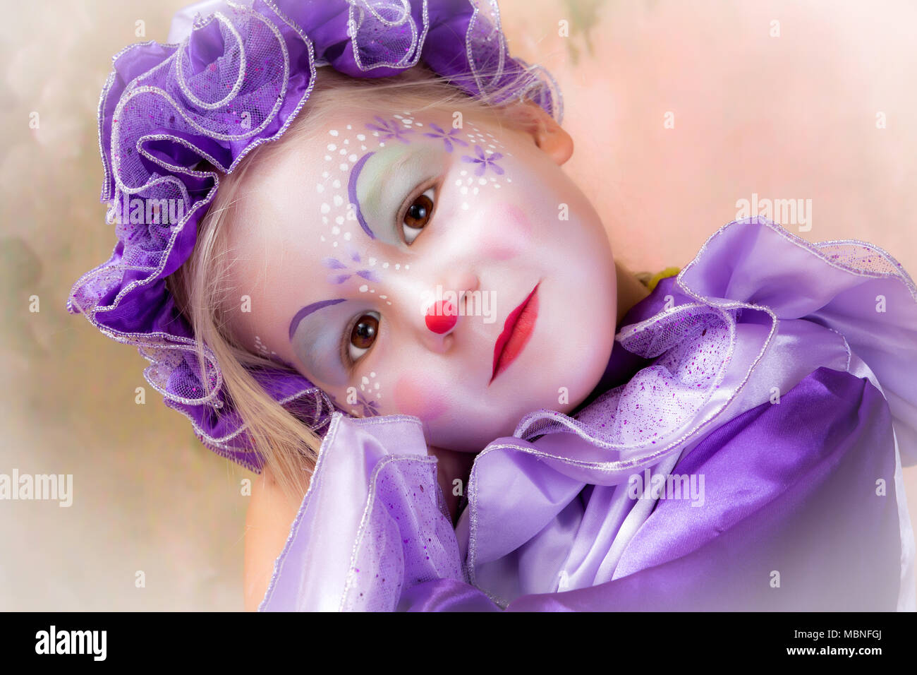Beautiful little blond girl in clown disguise Stock Photo - Alamy
