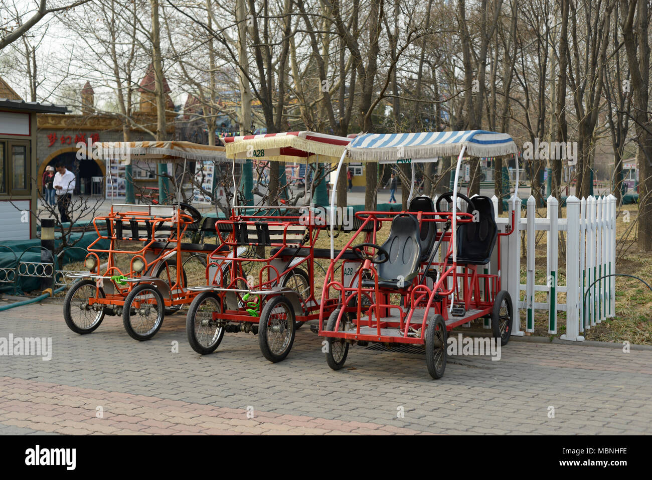 Cycle buggies parked in Chaoyang park, Beijing, China, awaiting paying ...