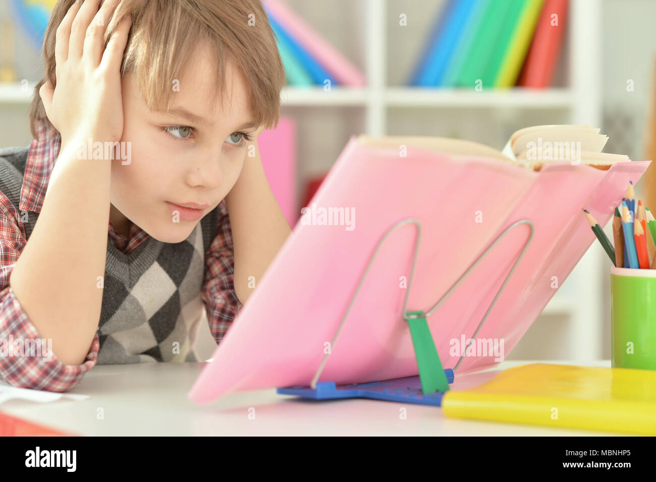 Boy doing homework Stock Photo - Alamy