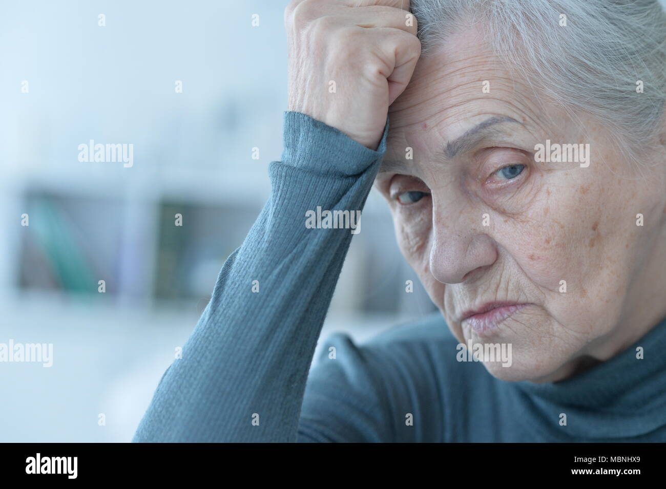Sad senior woman Stock Photo - Alamy