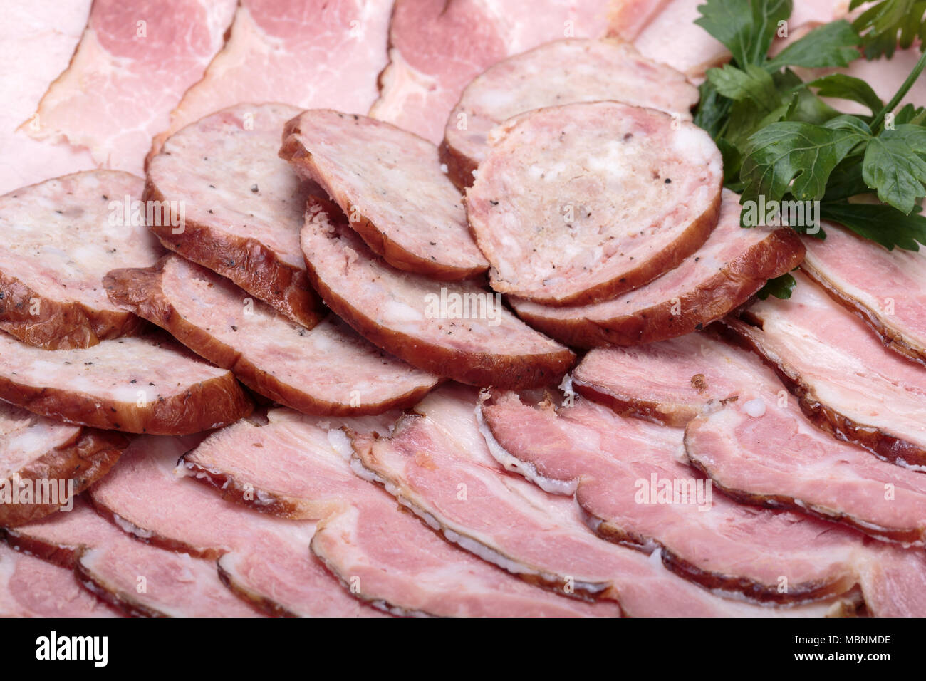 Plate of smoked meat isolated on white background Stock Photo - Alamy